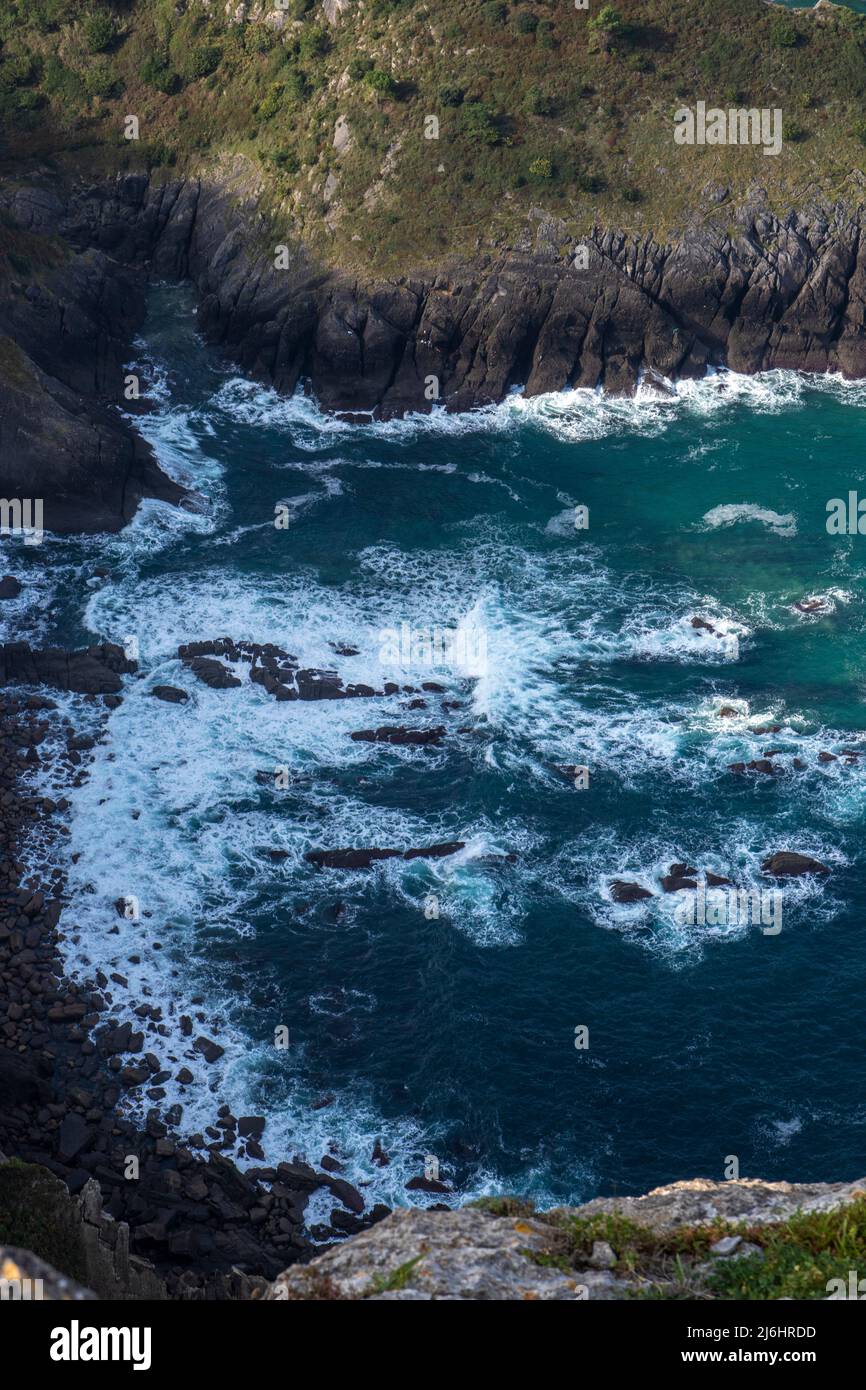 rocky cove on the basque coast a day with waves Stock Photo - Alamy