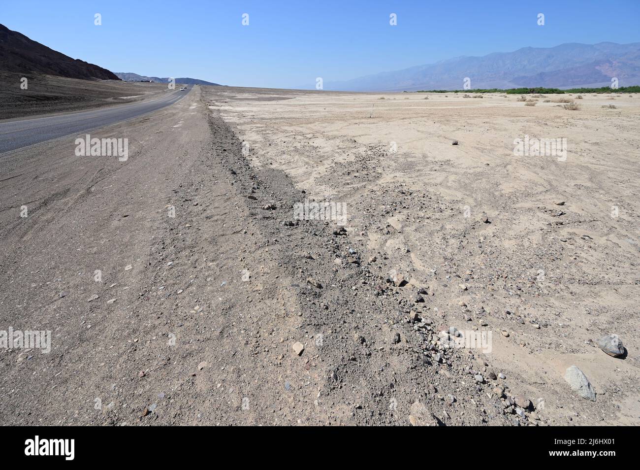 The hot dry flat land at the basin of Death Valley National park in ...