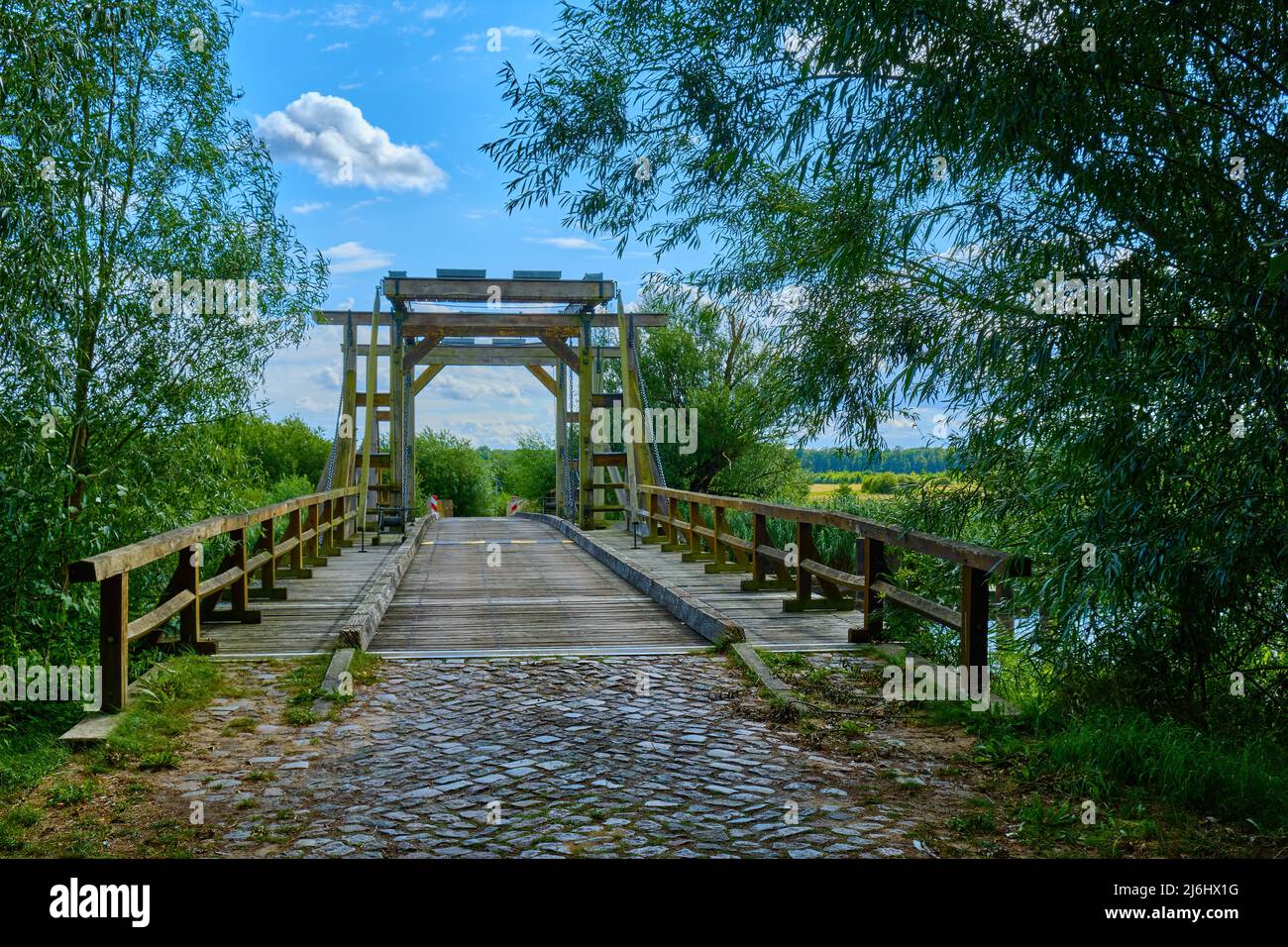 Listed wooden bascule bridge spanning the Trebel near Nehringen ...