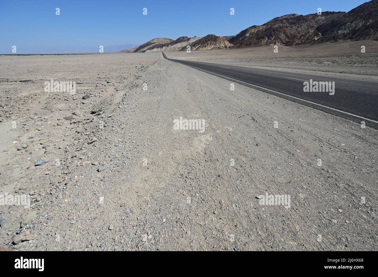 The hot dry flat land at the basin of Death Valley National park in ...