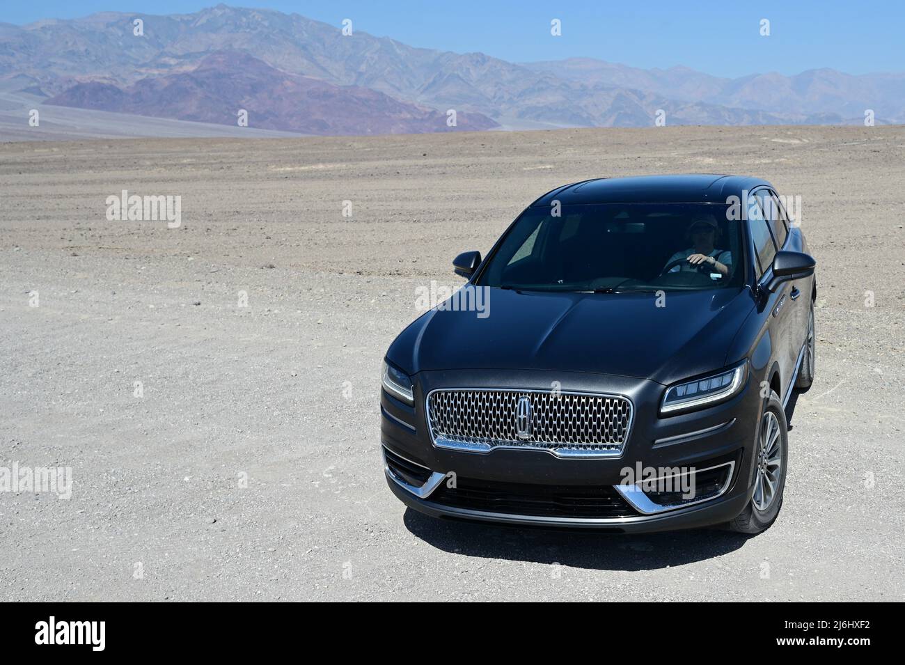 The hot dry flat land at the basin of Death Valley National park in ...