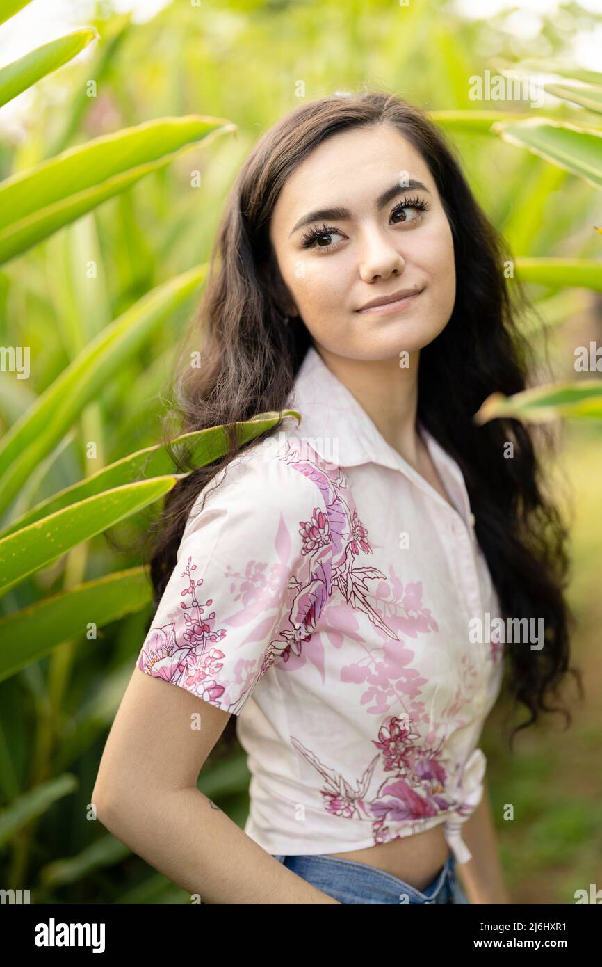 Young woman wearing Kariyushi shirt (かりゆしウェア, kariyushi wear in Okinawa ...