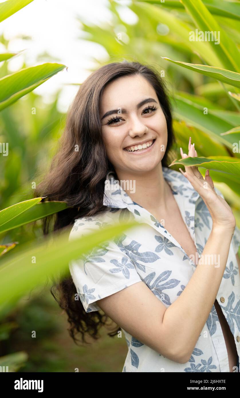 Young woman wearing Kariyushi shirt (かりゆしウェア, kariyushi wear in Okinawa ...