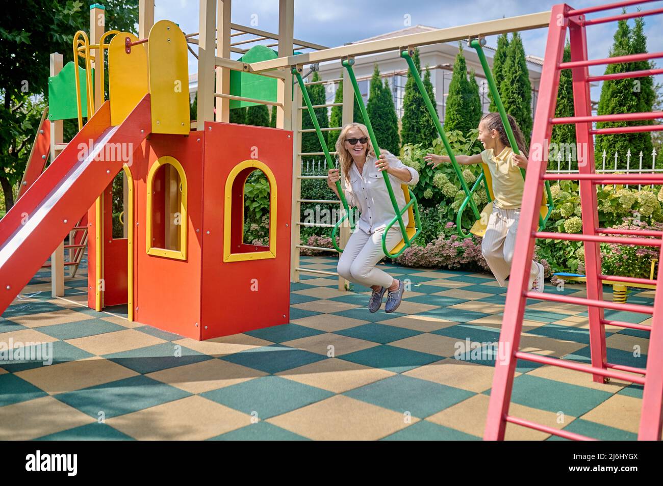 Mom daughter on swing hi-res stock photography and images - Alamy