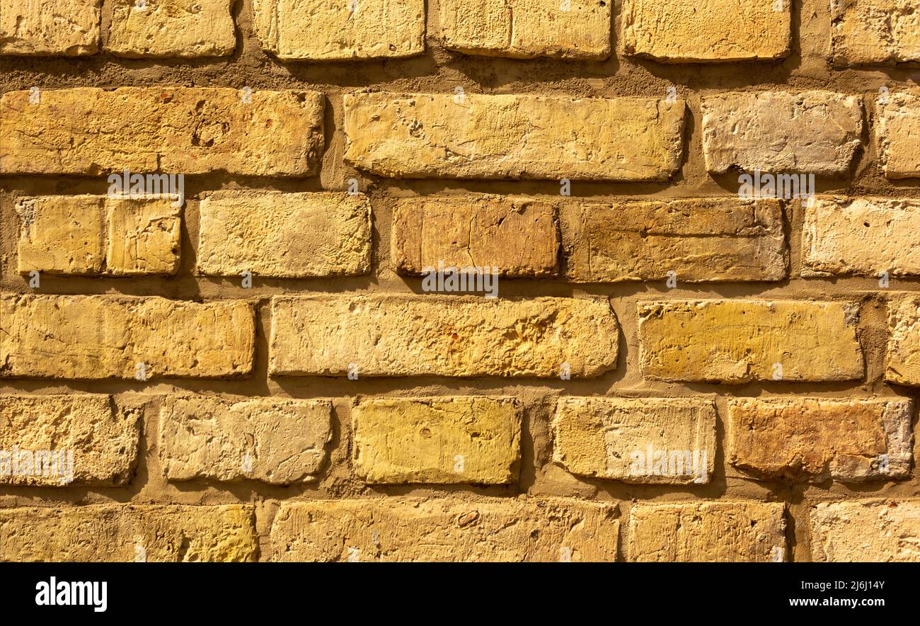 The texture of the wall of light beige brick close-up Stock Photo - Alamy