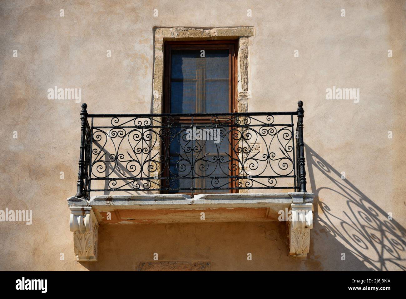 Old Neoclassical mansion facade with a Venetian stucco wall a wooden ...