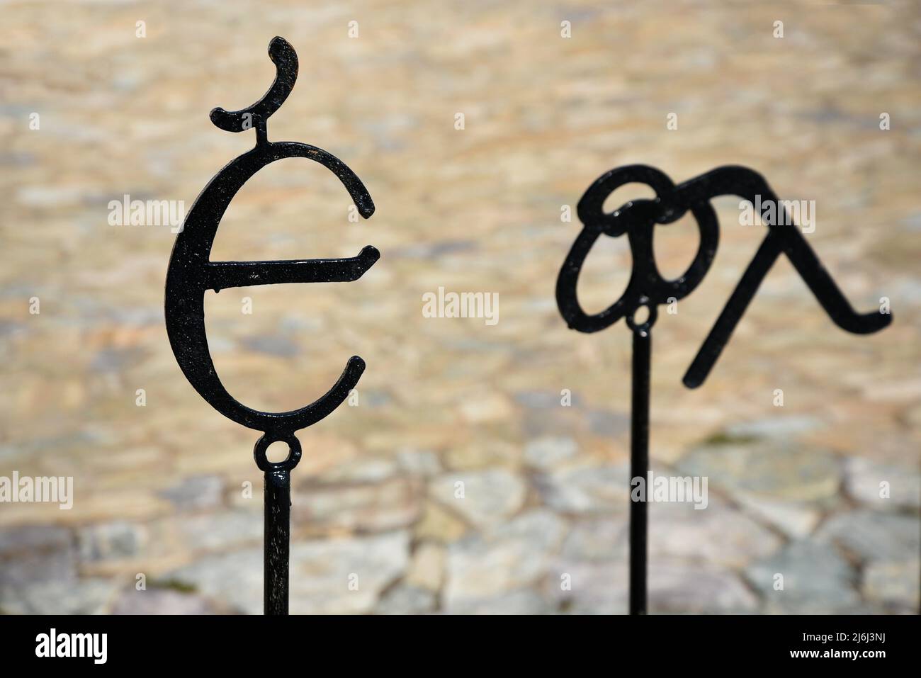 Handcrafted wrought iron Greek alphabet symbols found on the grounds of ...
