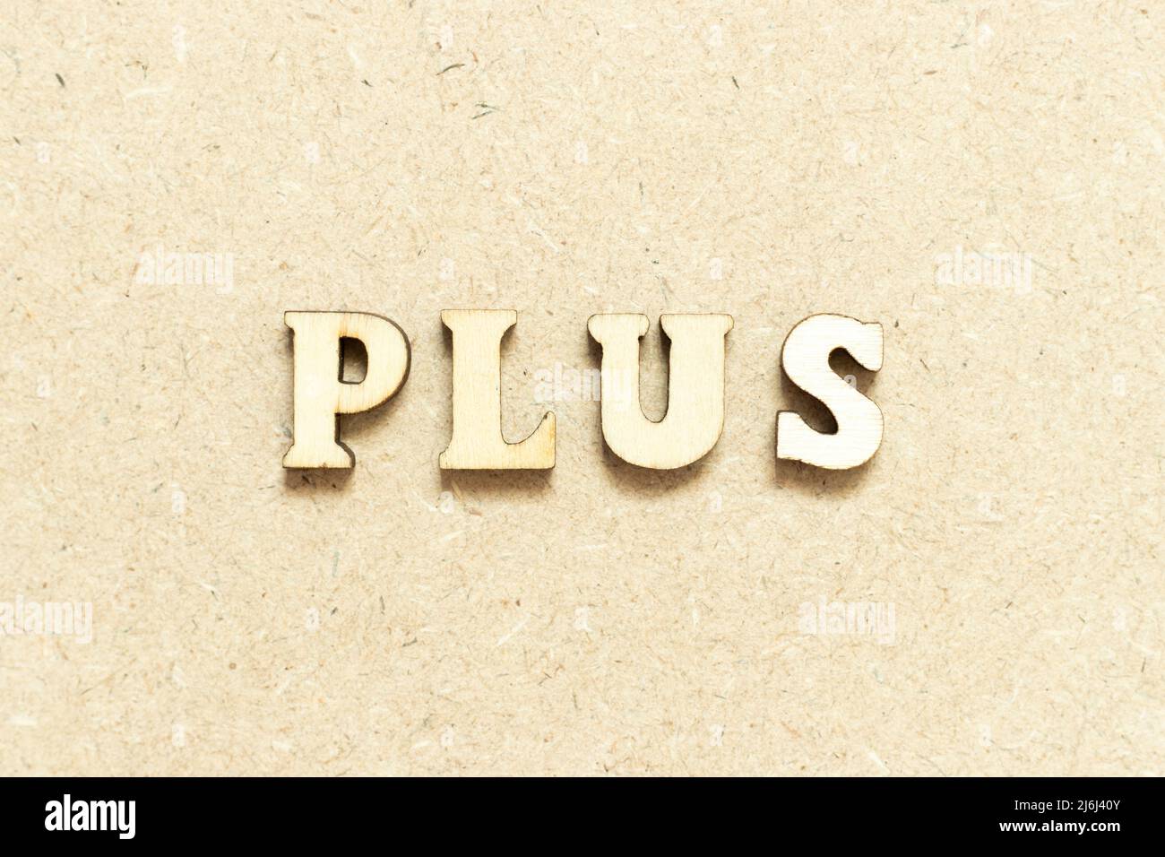Alphabet letter in word plus on wood background Stock Photo - Alamy
