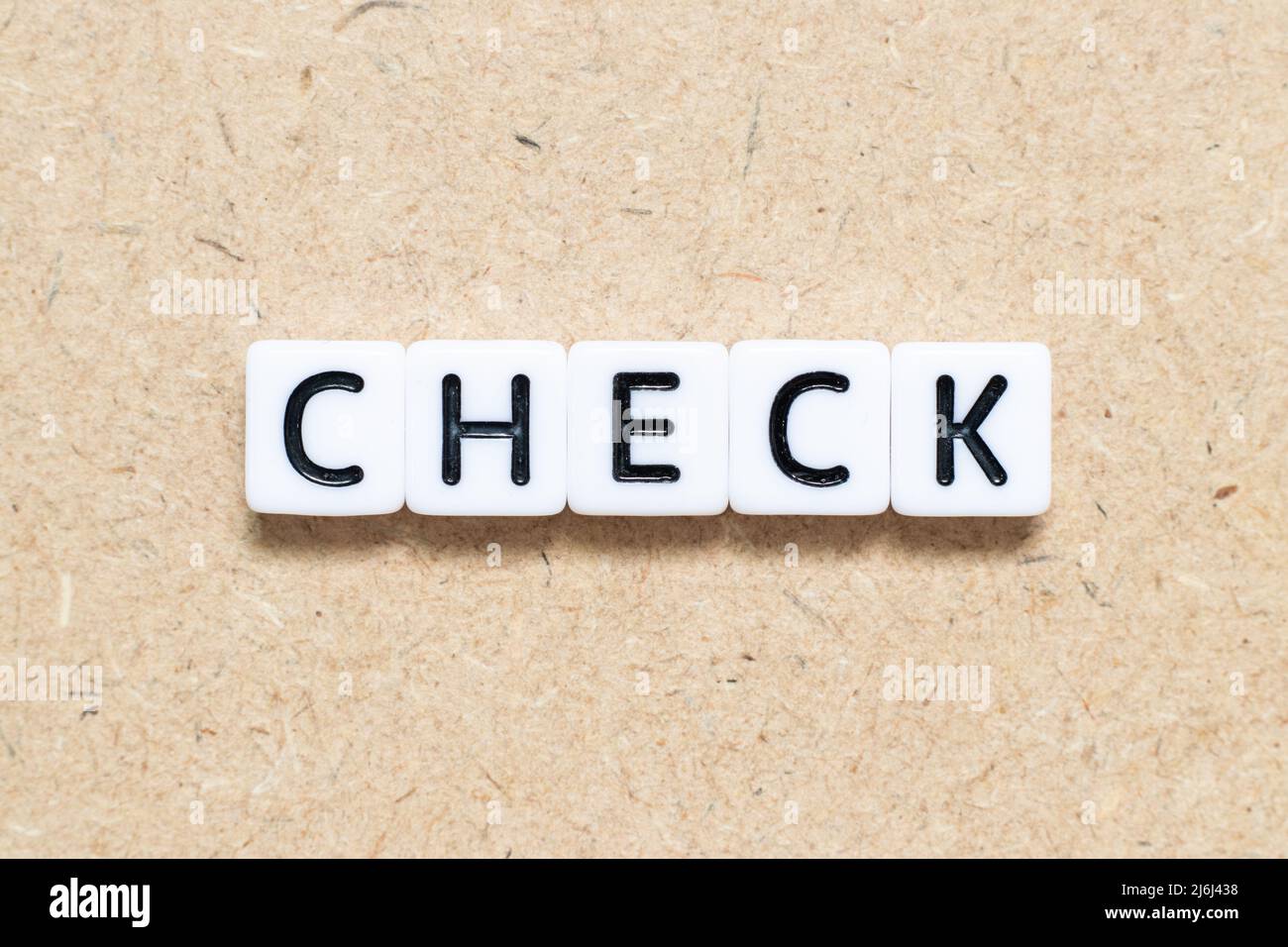 White tile alphabet letter with word check on wood background Stock ...