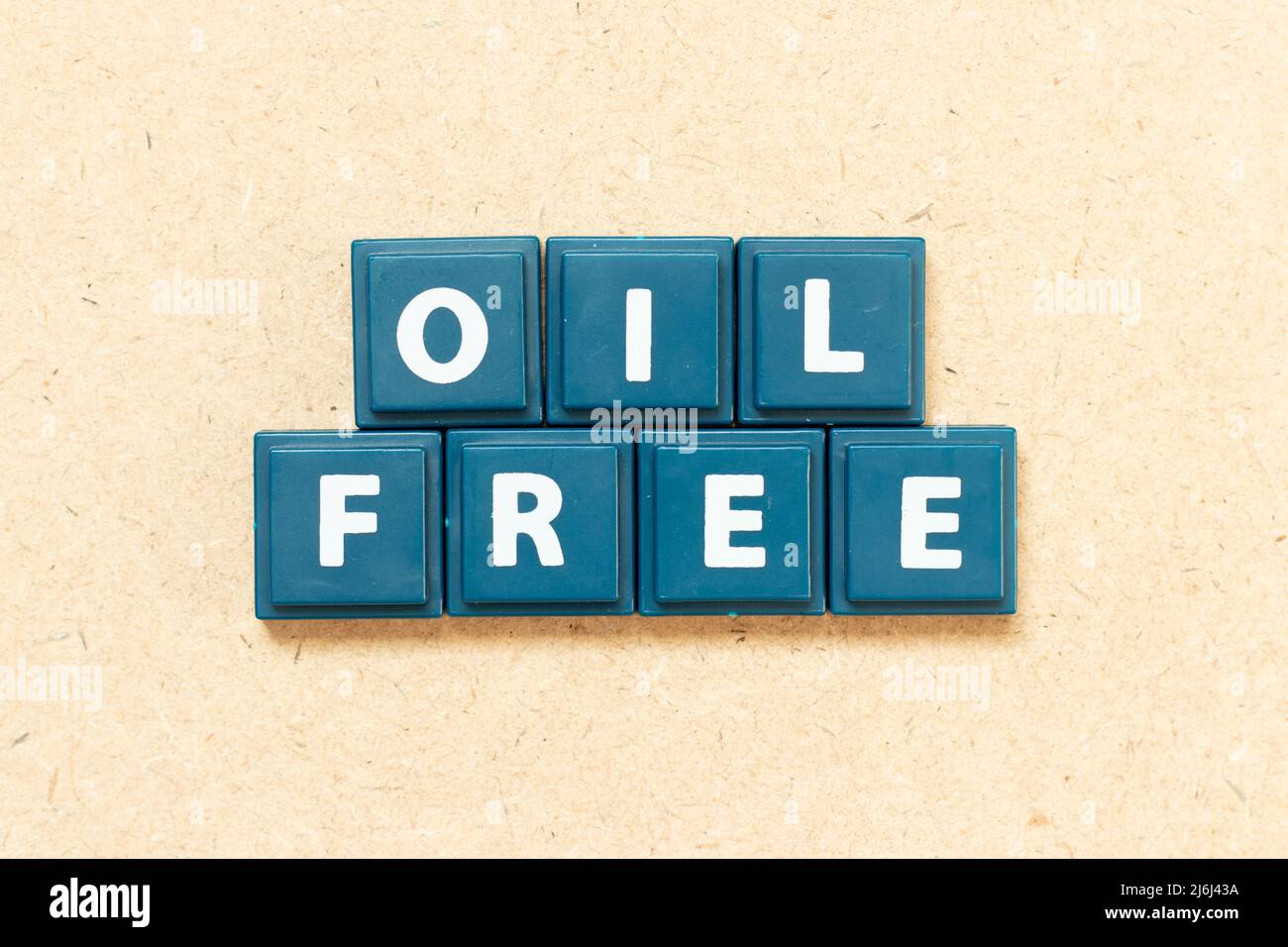 Tile alphabet letter in word oil free on wood background Stock Photo ...