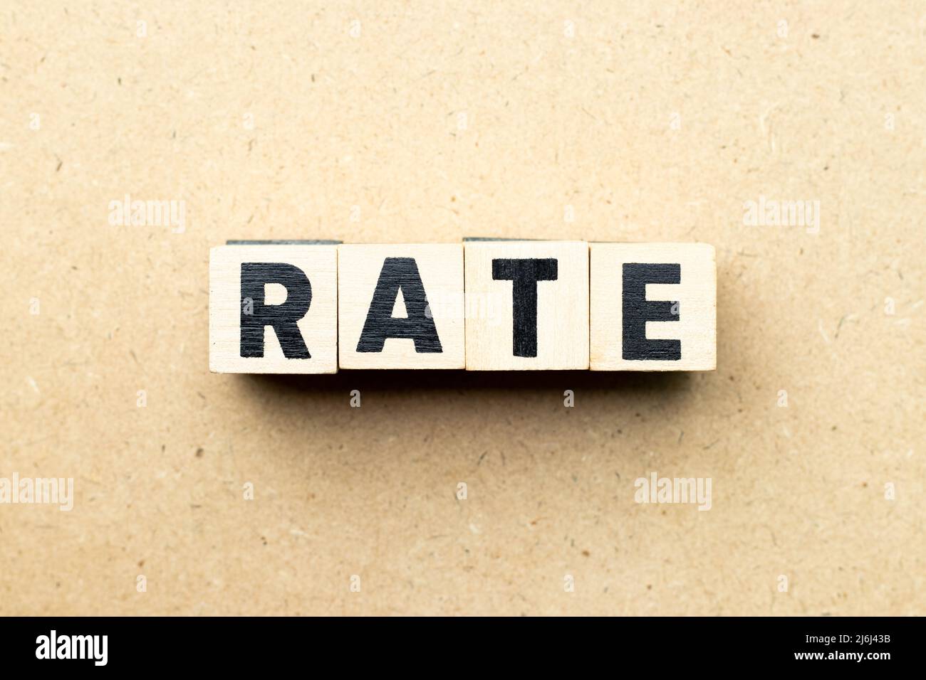Alphabet letter block in word rate on wood background Stock Photo - Alamy