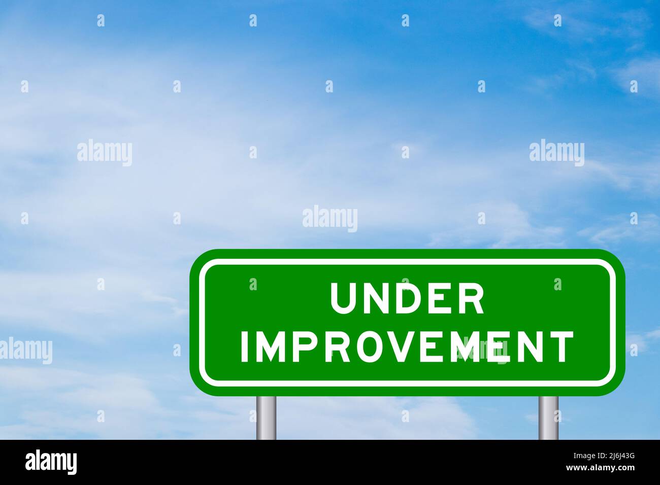 Green color transportation sign with word under improvement on blue sky ...