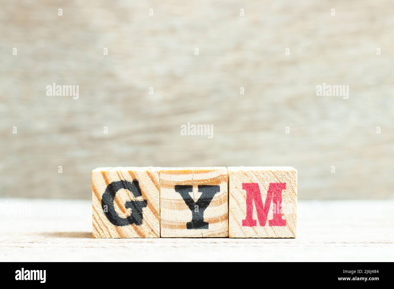 Alphabet letter block in word gym on wood background Stock Photo - Alamy