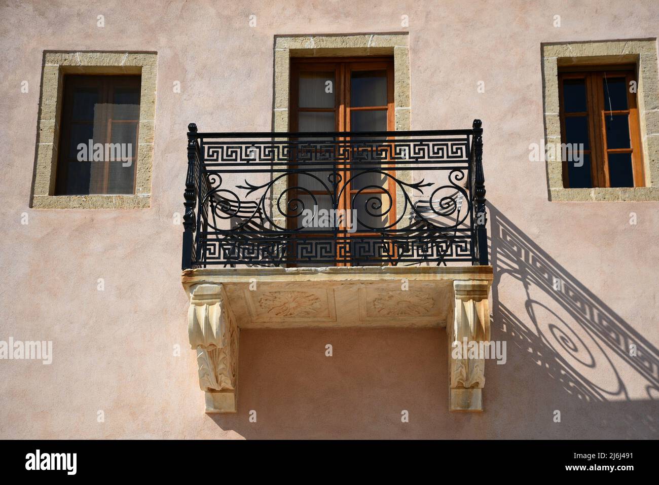 Old Neoclassical mansion facade with a Venetian stucco wall wooden ...
