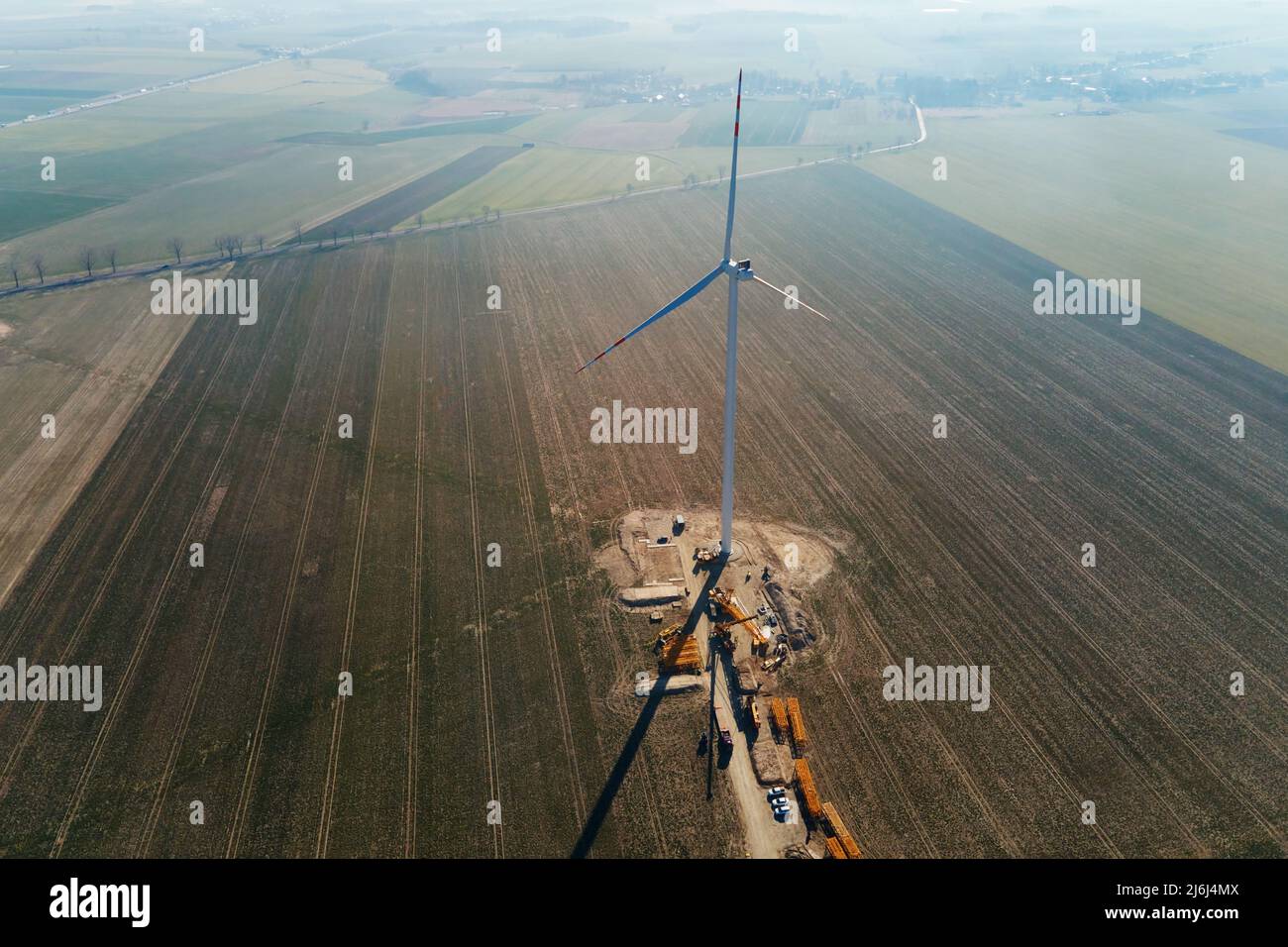 Construction site near windmill turbine, Wind generator installing ...