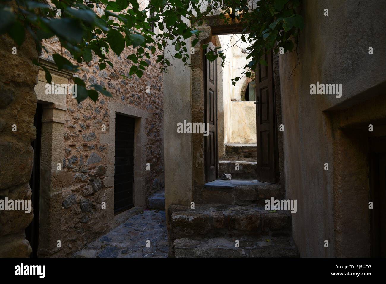 Old cobblestoned alley with traditional Venetian style houses in the ...