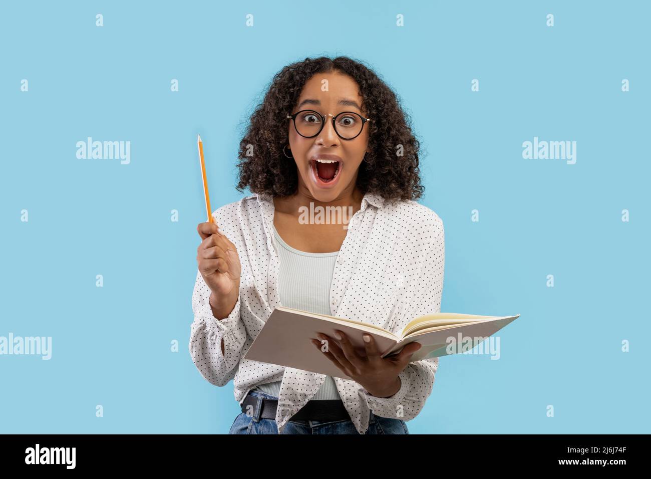 Excited young black female student having brilliant idea, finding ...
