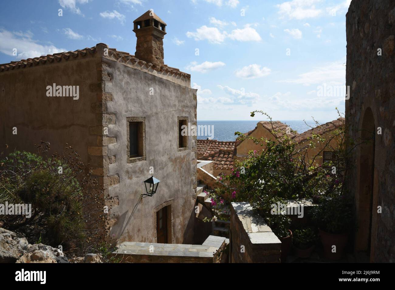 Old traditional Venetian style house with a stucco wall and a clay tile ...