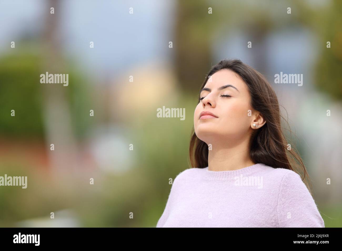 Relaxed teen breathing fresh air in a park Stock Photo - Alamy