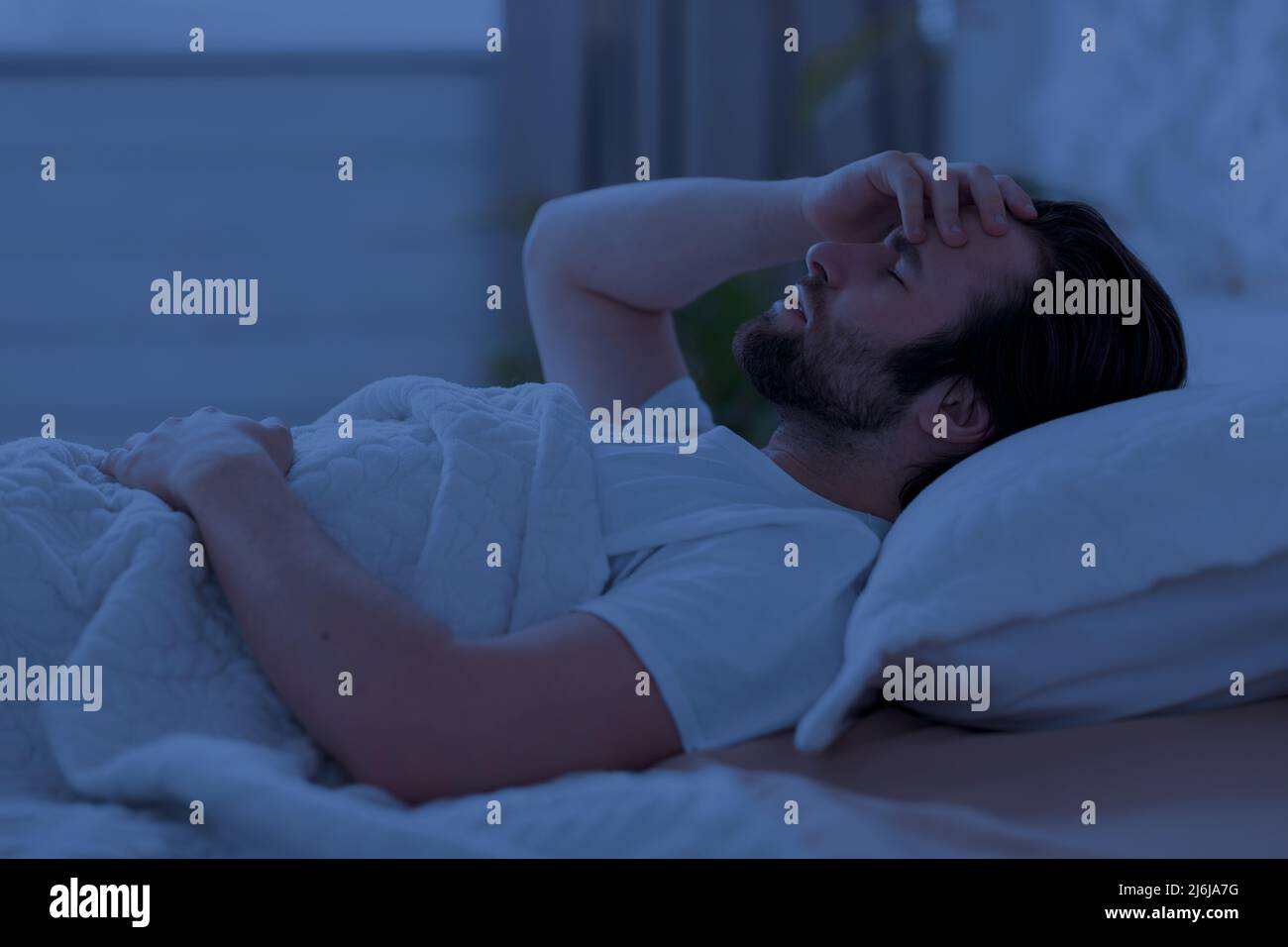 Man laying in bed hi-res stock photography and images - Alamy
