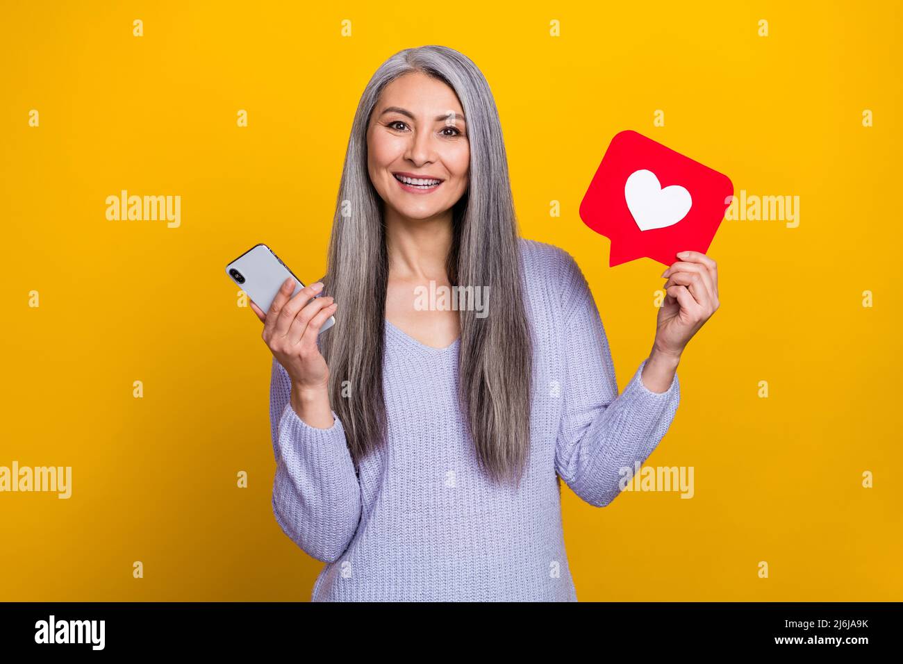 Photo of attractive modern grandma receive many likes on her blog post ...