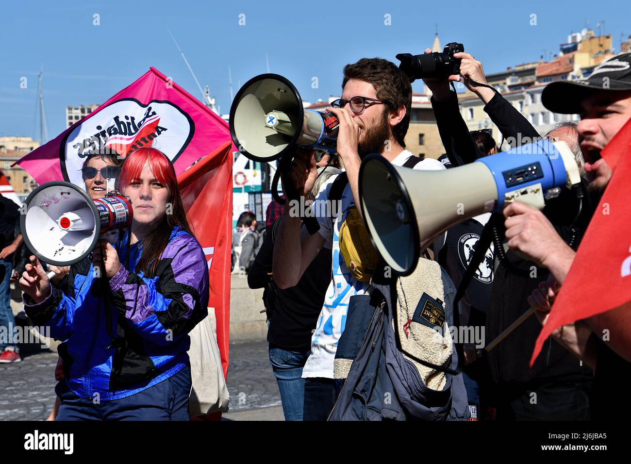 Protesters speak through the megaphones during the demonstration ...
