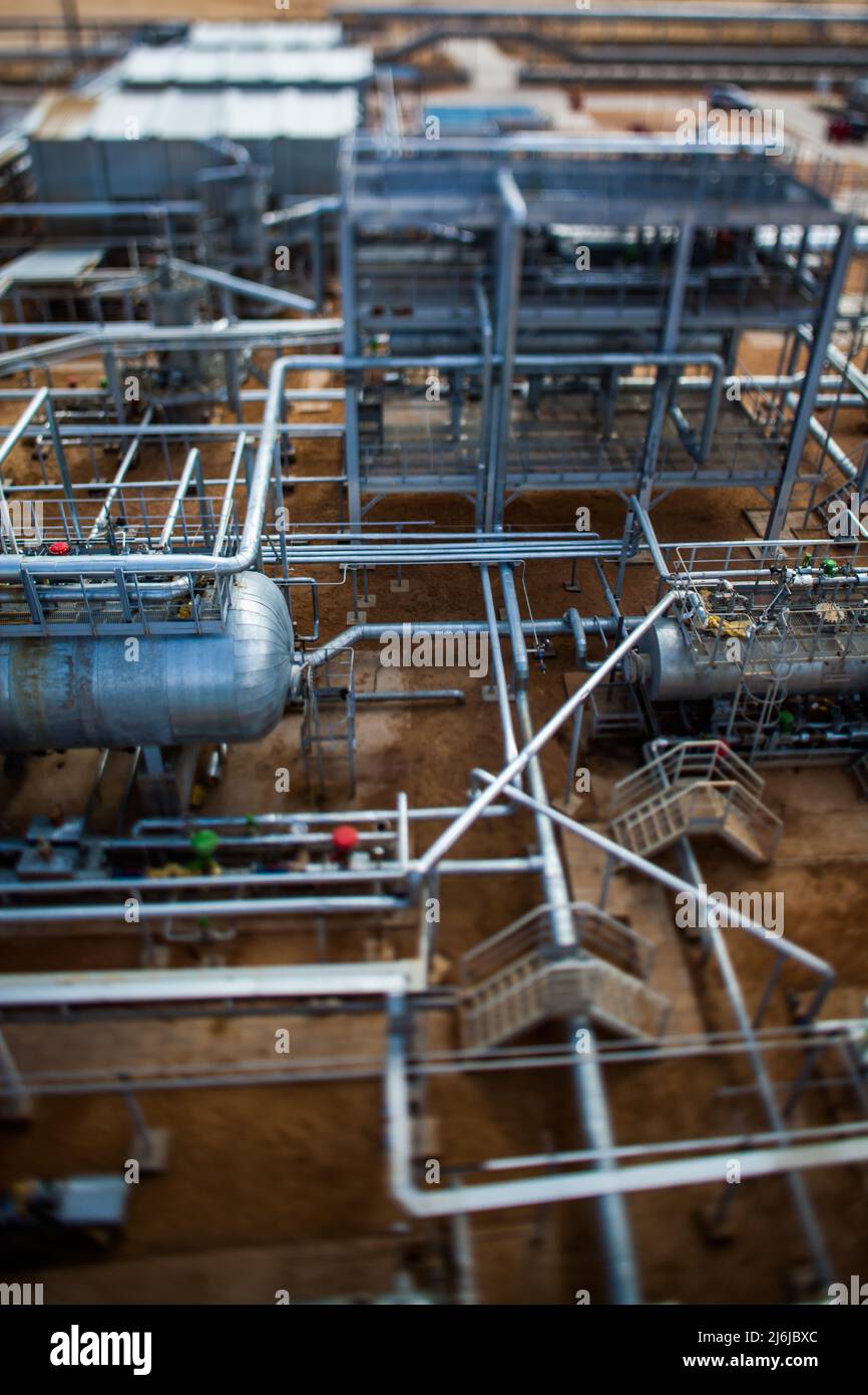 Grey metal pipes of distillation tower (column). Oil refinery plant in ...