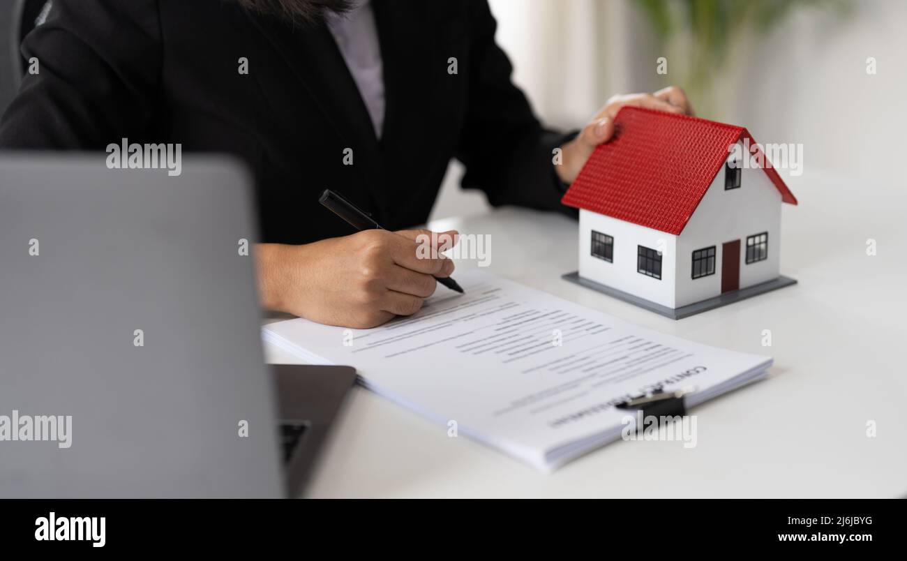 agents working in real estate investment and home insurance signing ...