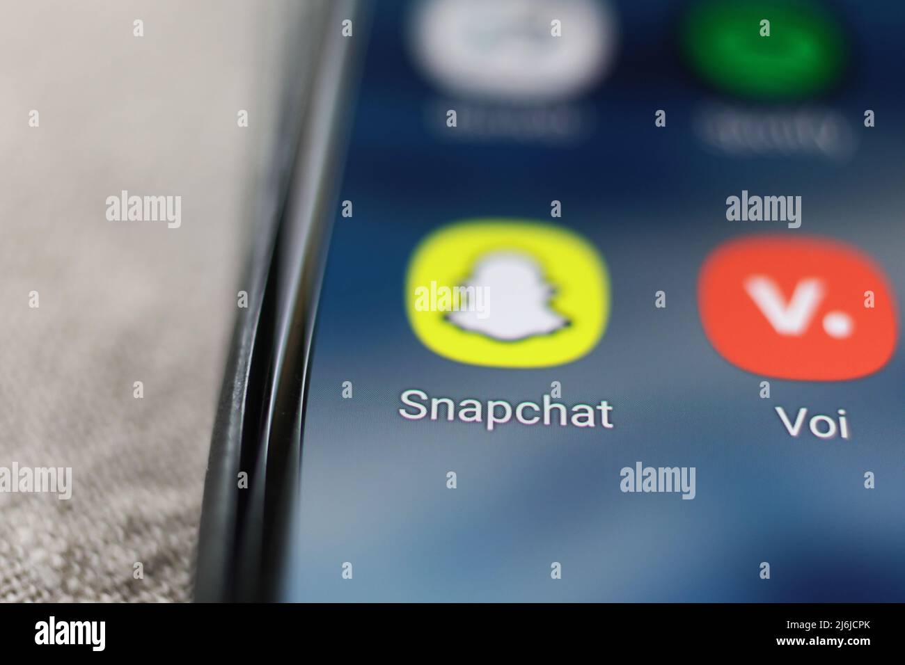 Different mobile applications in a mobile phone, Snapchat and Voi Stock ...