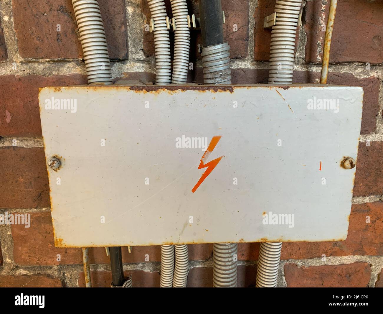 Electricity caution sign. Old red sign Stock Photo - Alamy
