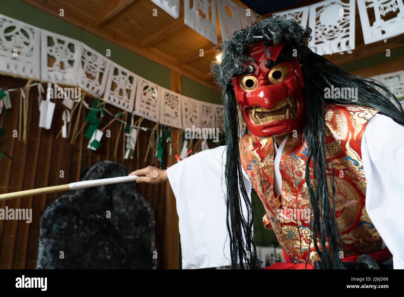 Fujisaki-san, a master of Kagura the Shinto ritual performance telling ...