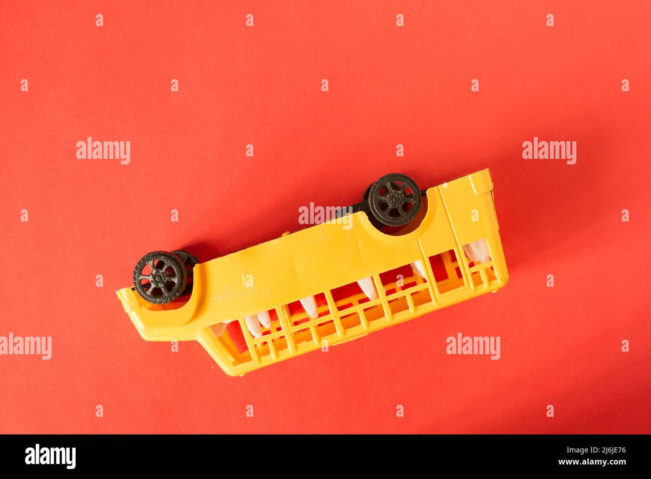 Accident with shcool bus concept. Toy bus upside down Stock Photo - Alamy