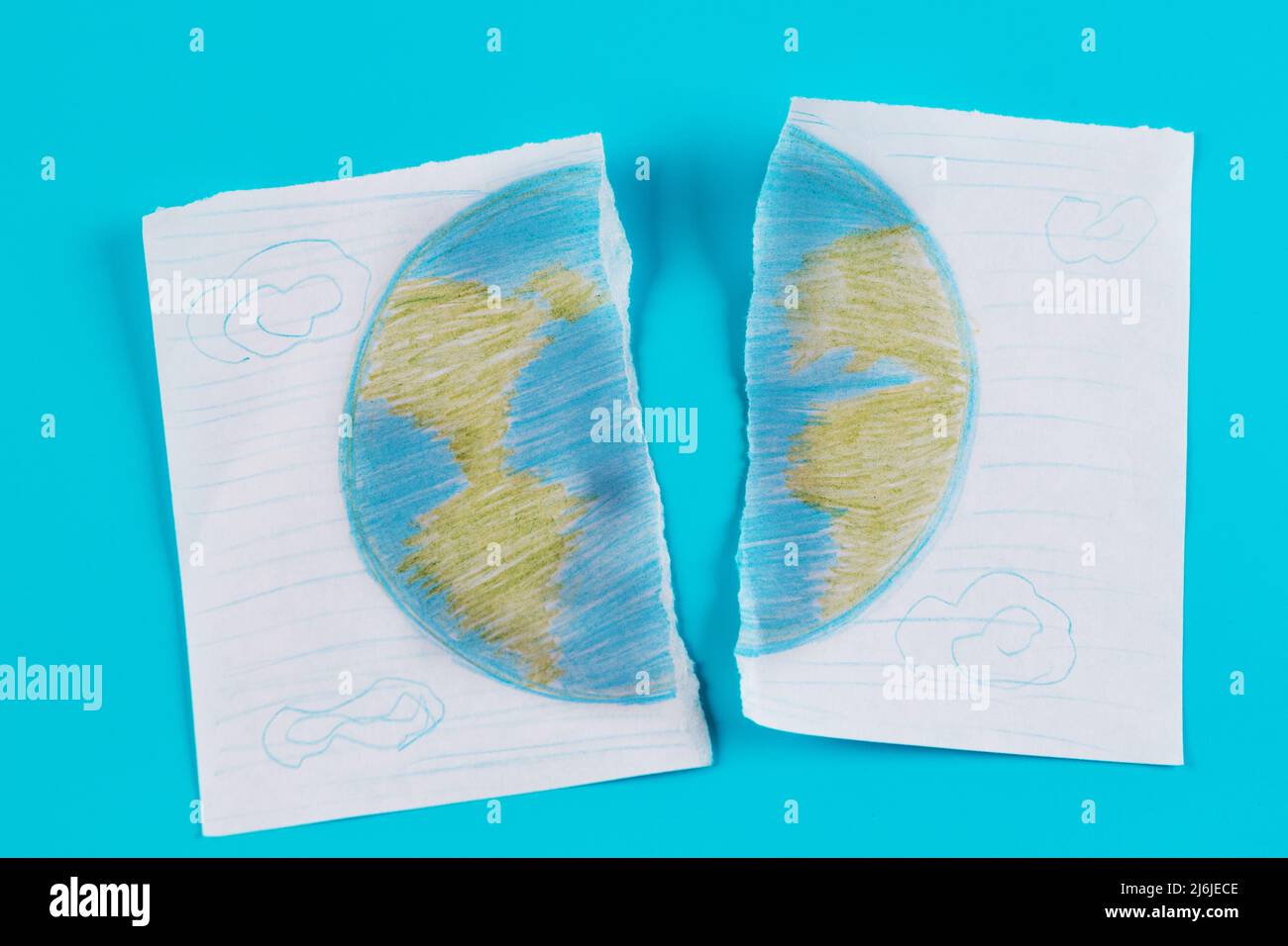 Drawing og the earth planet. Torn into pieces Stock Photo - Alamy