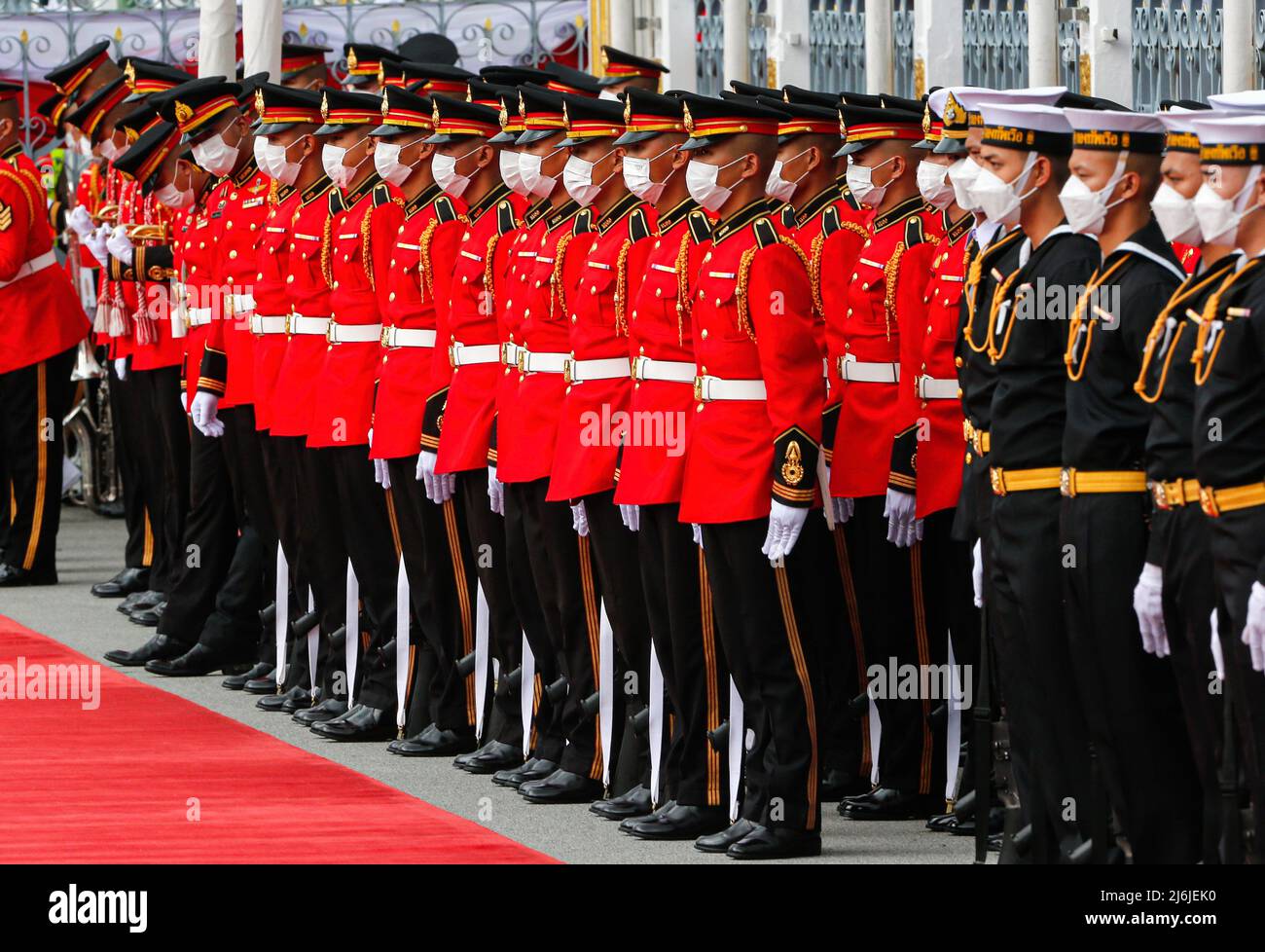 Guards of honor are seen wearing face masks as a preventive measure ...