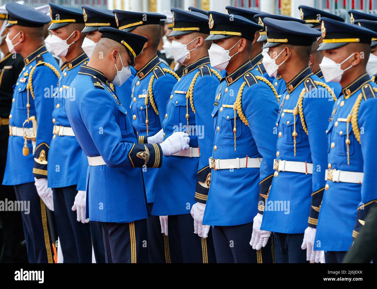 Guards of honor are seen wearing face masks as a preventive measure ...