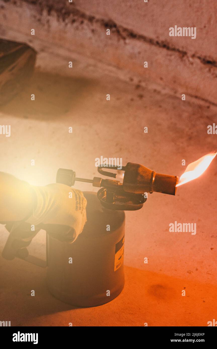 Gasoline blowtorch with a burning fire, the use of a blowtorch in ...