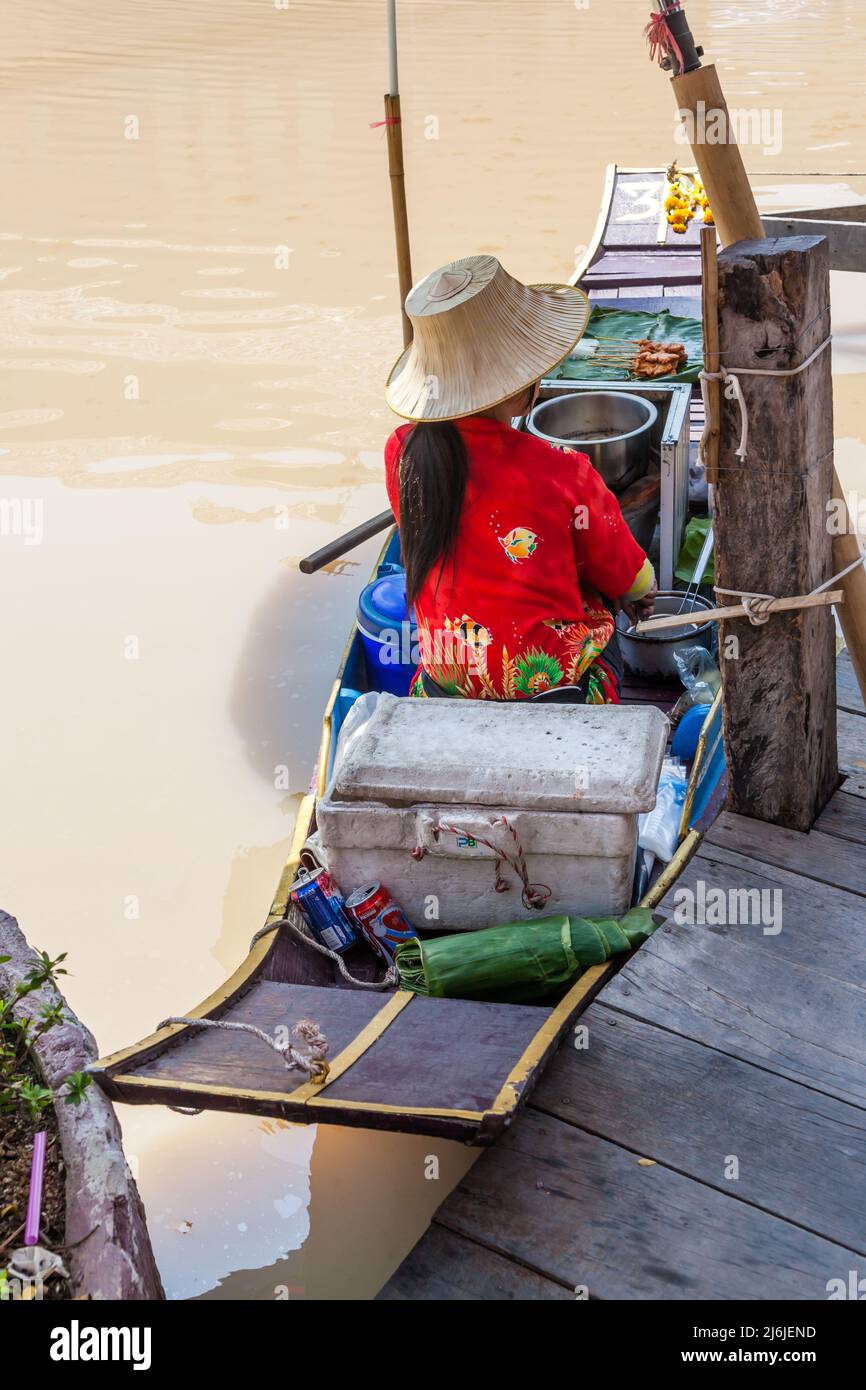 Pattaya, Thailand - December 6, 2009: Vendor in boat at Pattaya ...