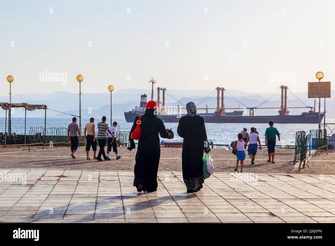Aqaba, Jordan - May 23, 2009: Walking people at waterfront in Aqaba ...