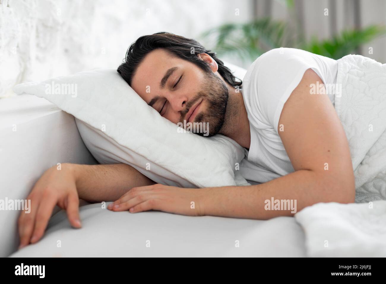 Closeup of young man sleeping in bed at home Stock Photo - Alamy