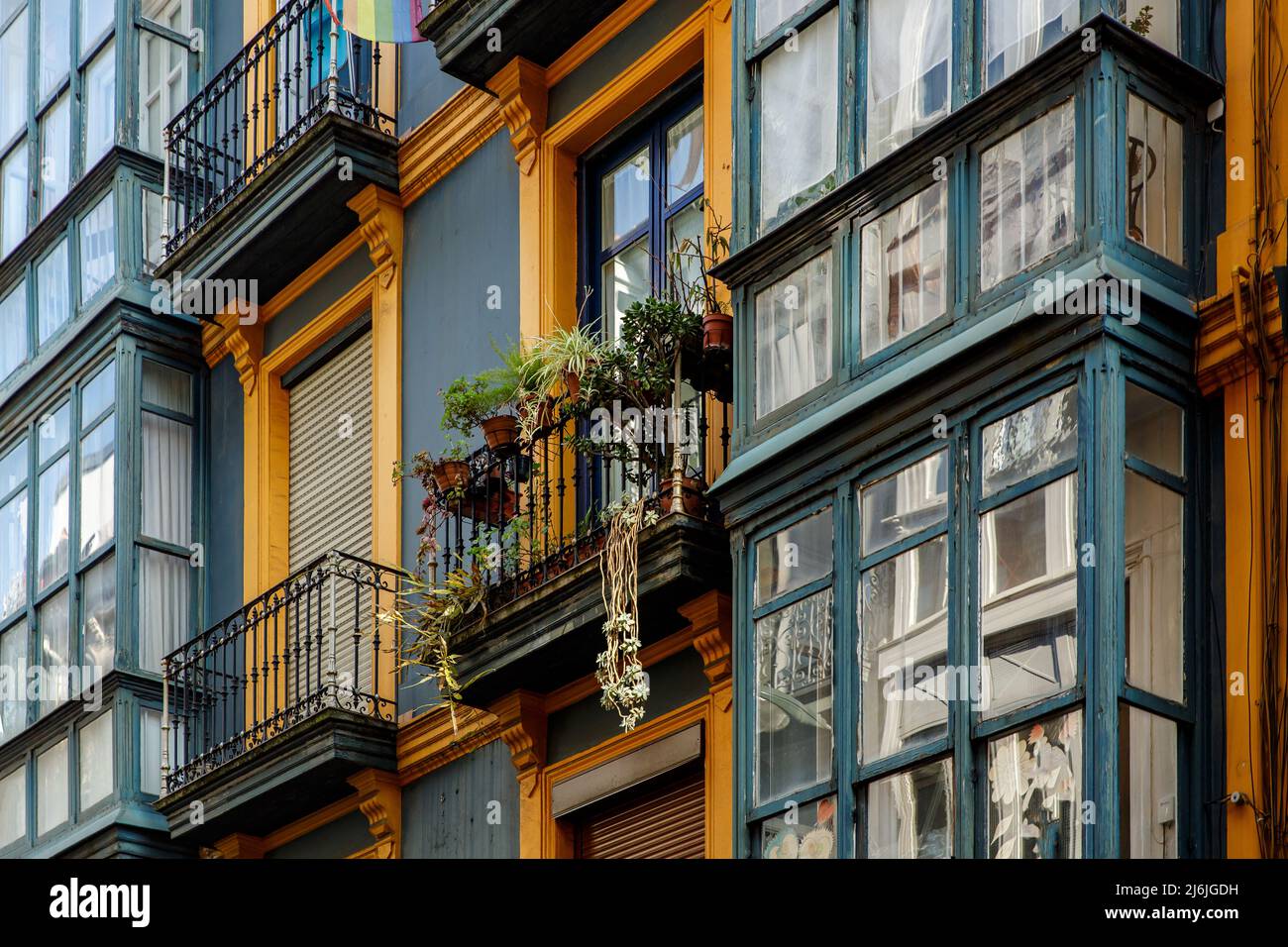 Vintage balconies with shutters downtown in Bilbao, Basque Country ...