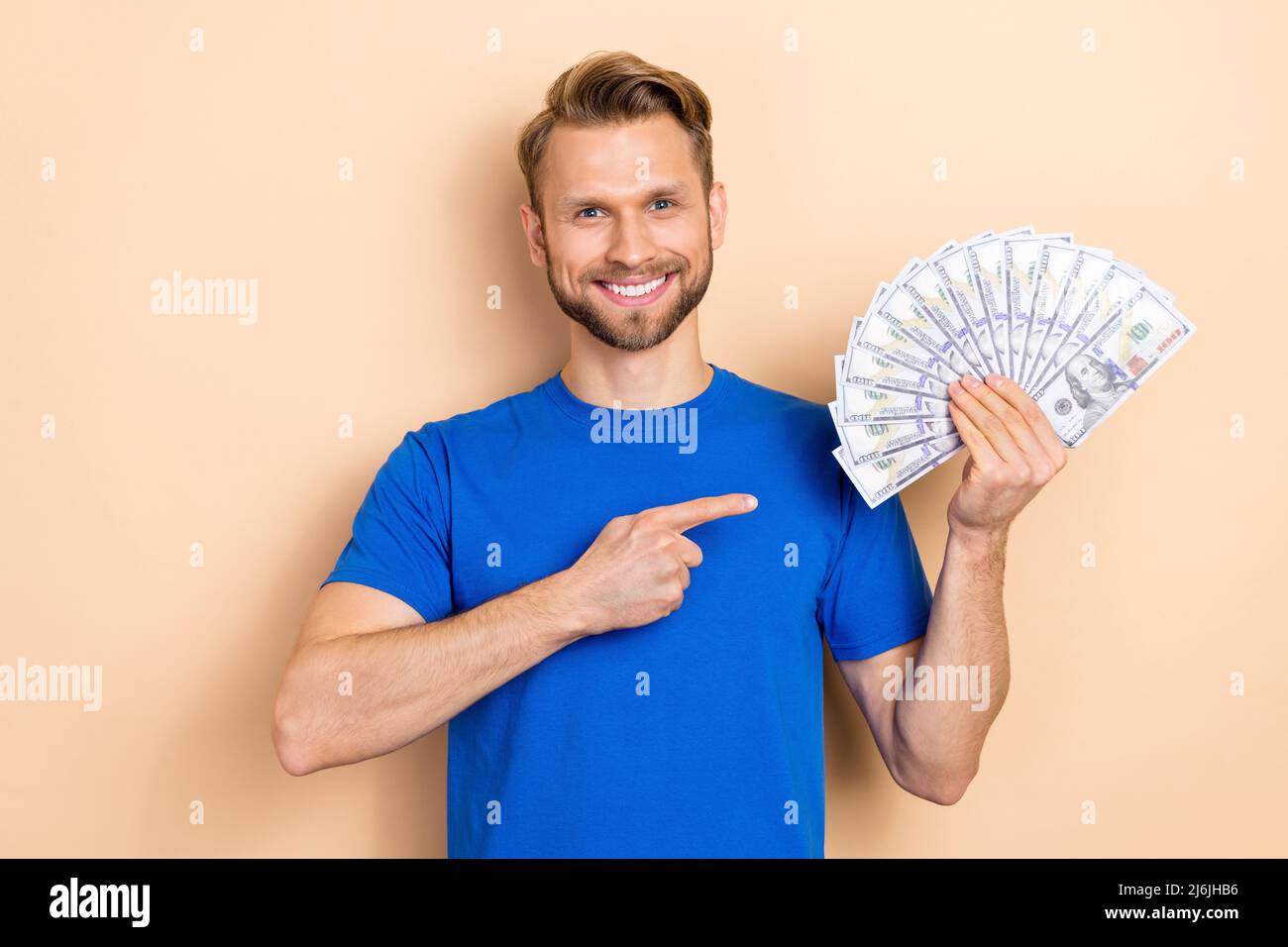 Photo of young guy indicate finger money suggest recommend profit ...