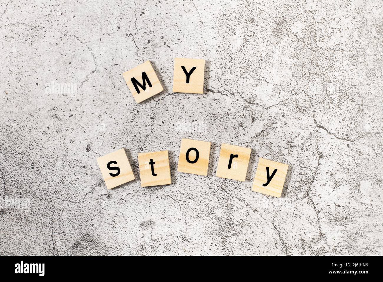 My Story written with wooden letter blocks on a stone background Stock ...