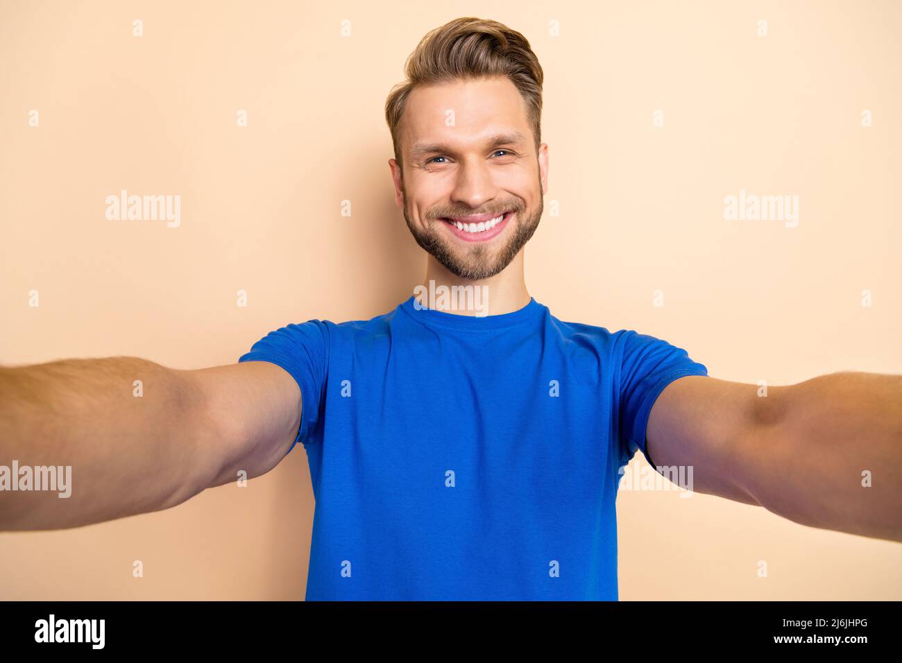 Photo of young cheerful man make take selfie influencer journey ...