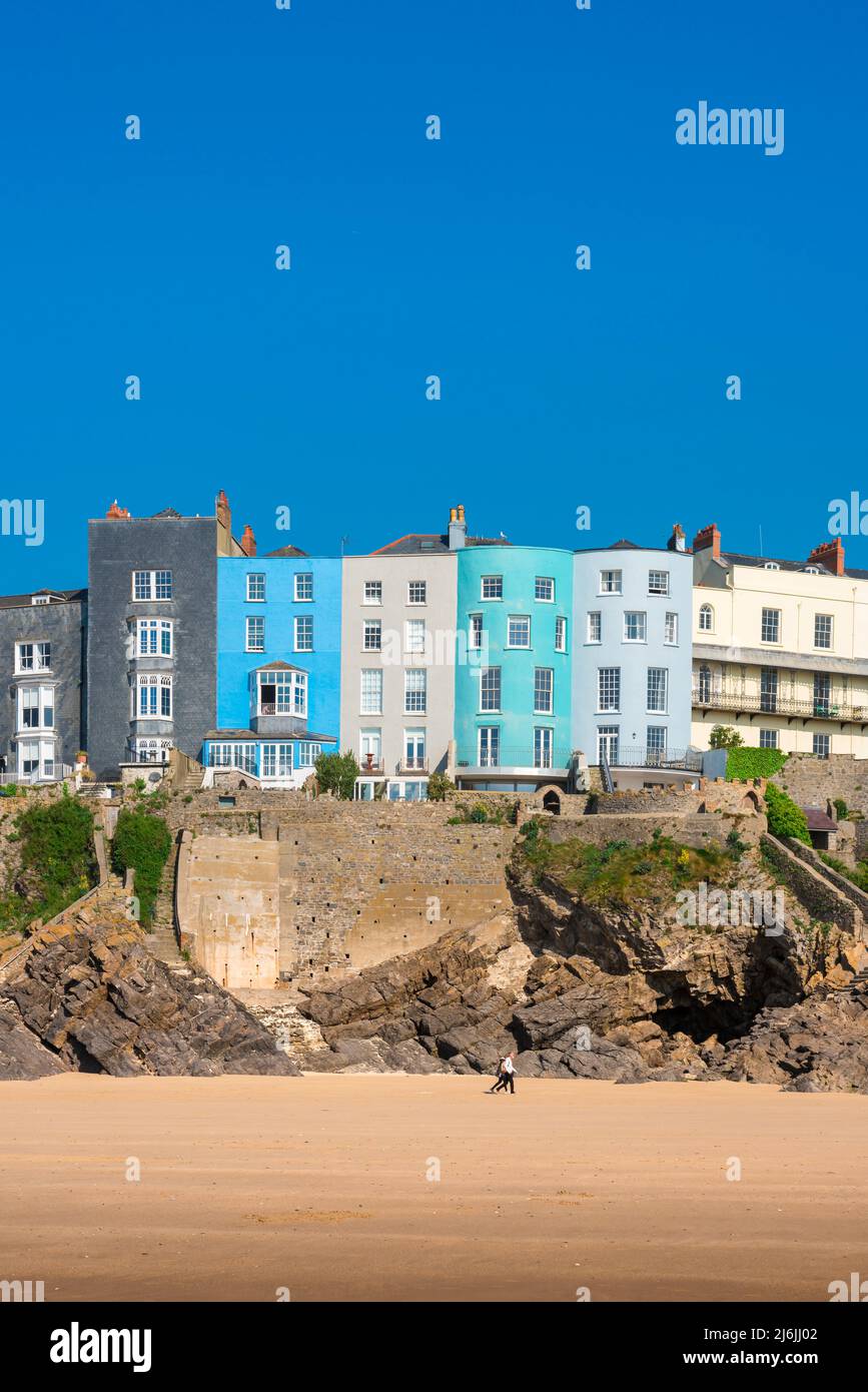 Tenby South Beach, view in summer of people walking below colourful ...