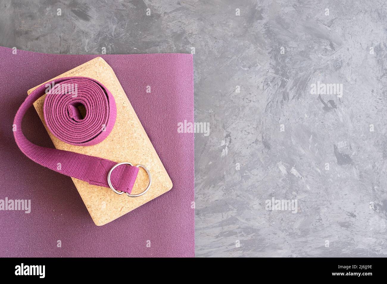 Open yoga mat with cork block and yoga belt. Yoga practice props ...