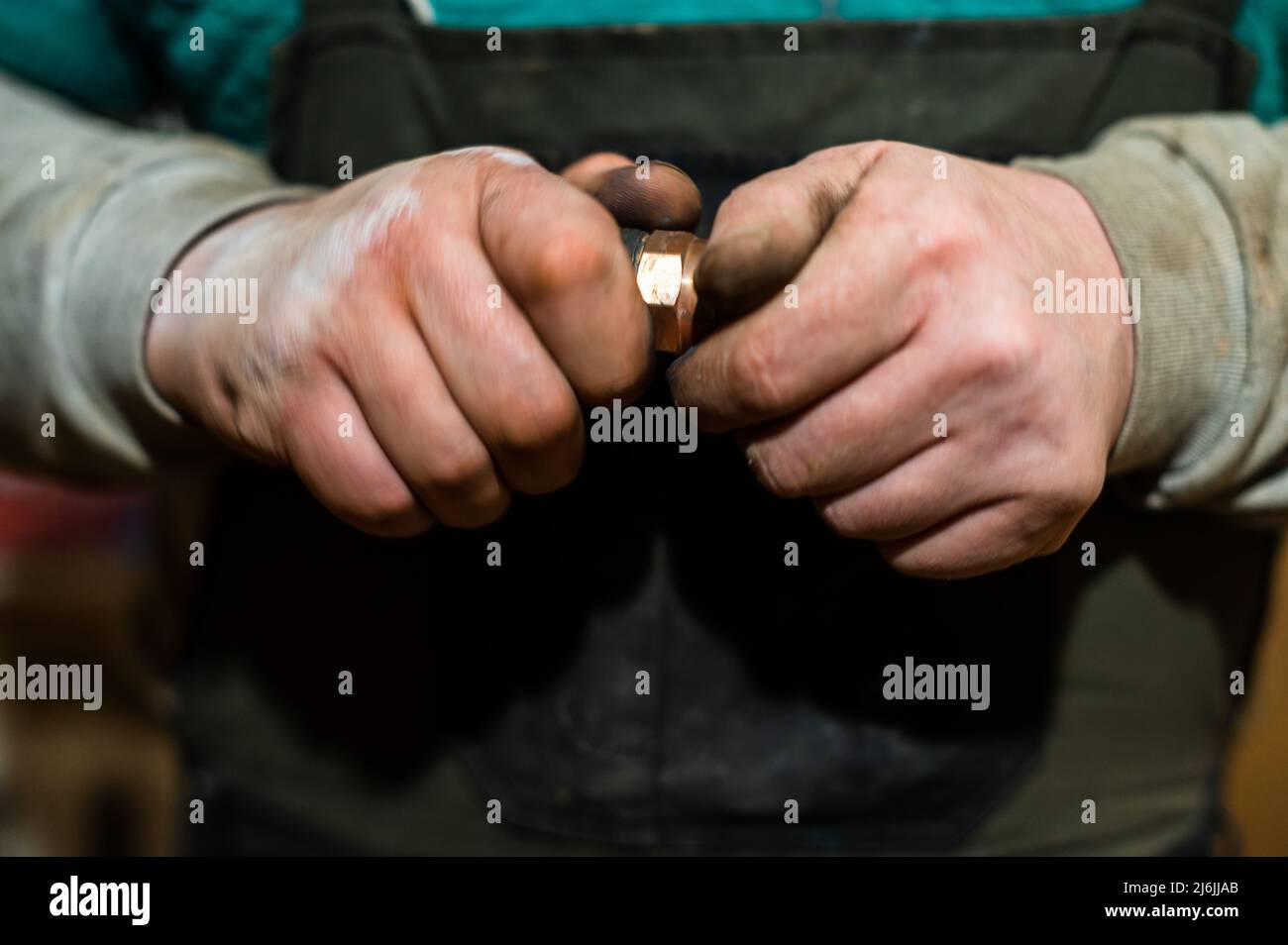 Winding of a sanitary tow on connection of copper pipes, plumbing paste ...