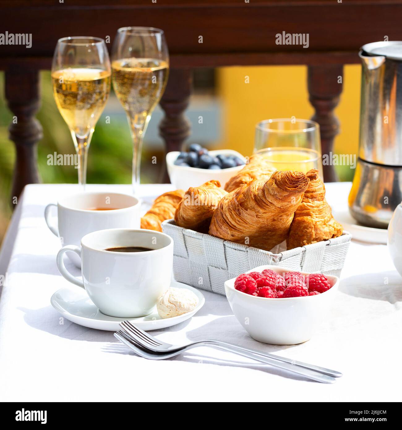 Luxury brunch on the hotel terrace, coffee maker, teapot, cups ...
