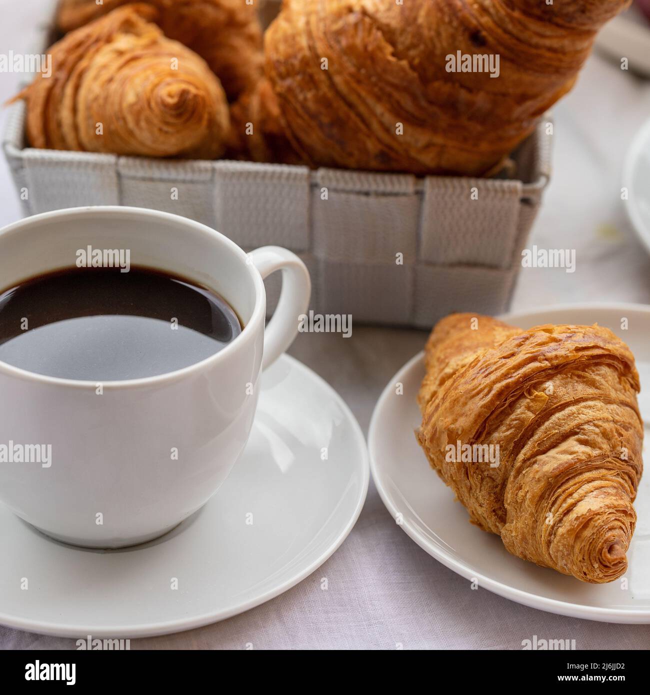 French breakfast, hot cup of coffee with croissants and orange juice ...