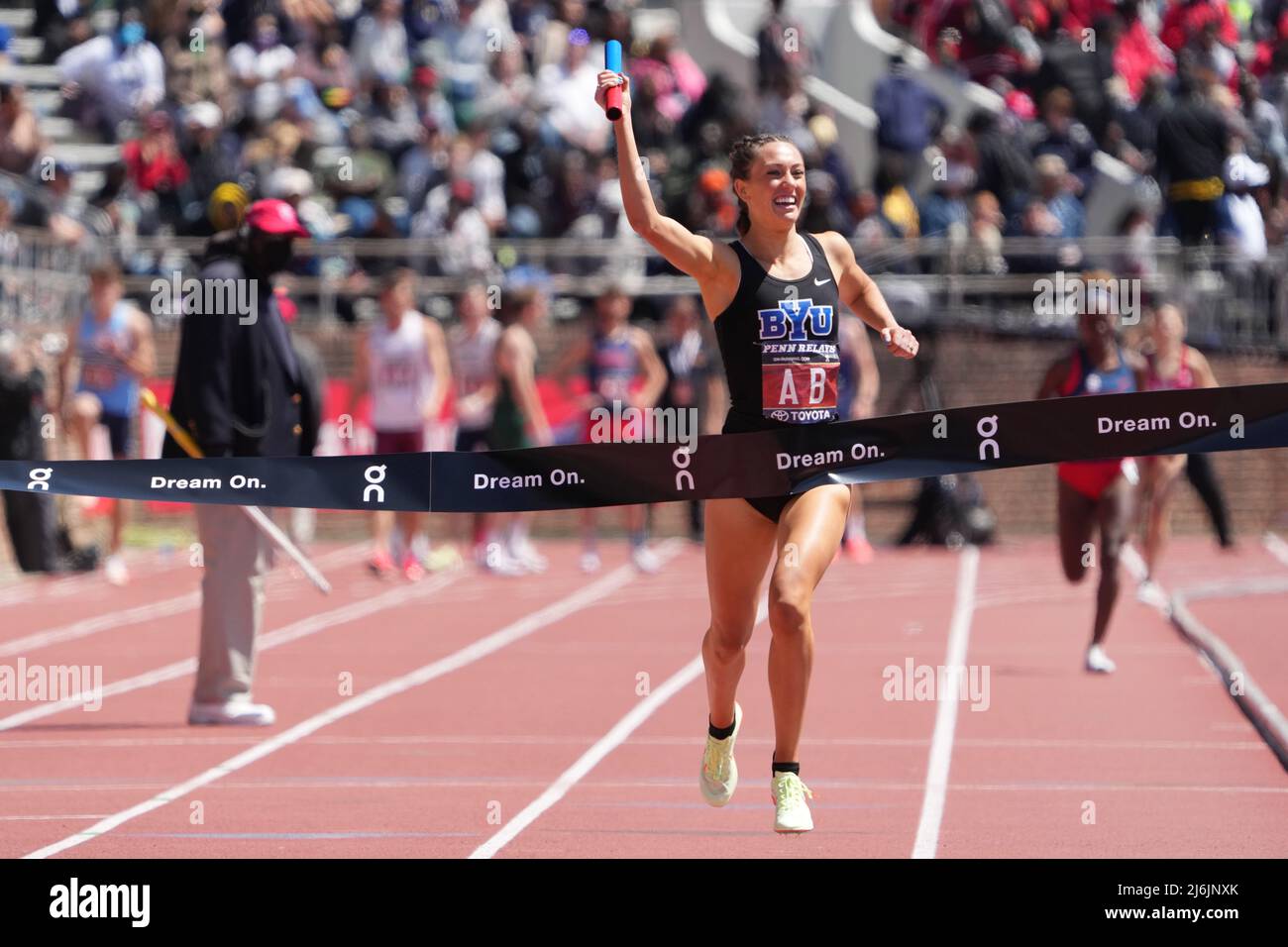 Courtney Wayment celebrates after running the 1,600m anchor leg on the ...