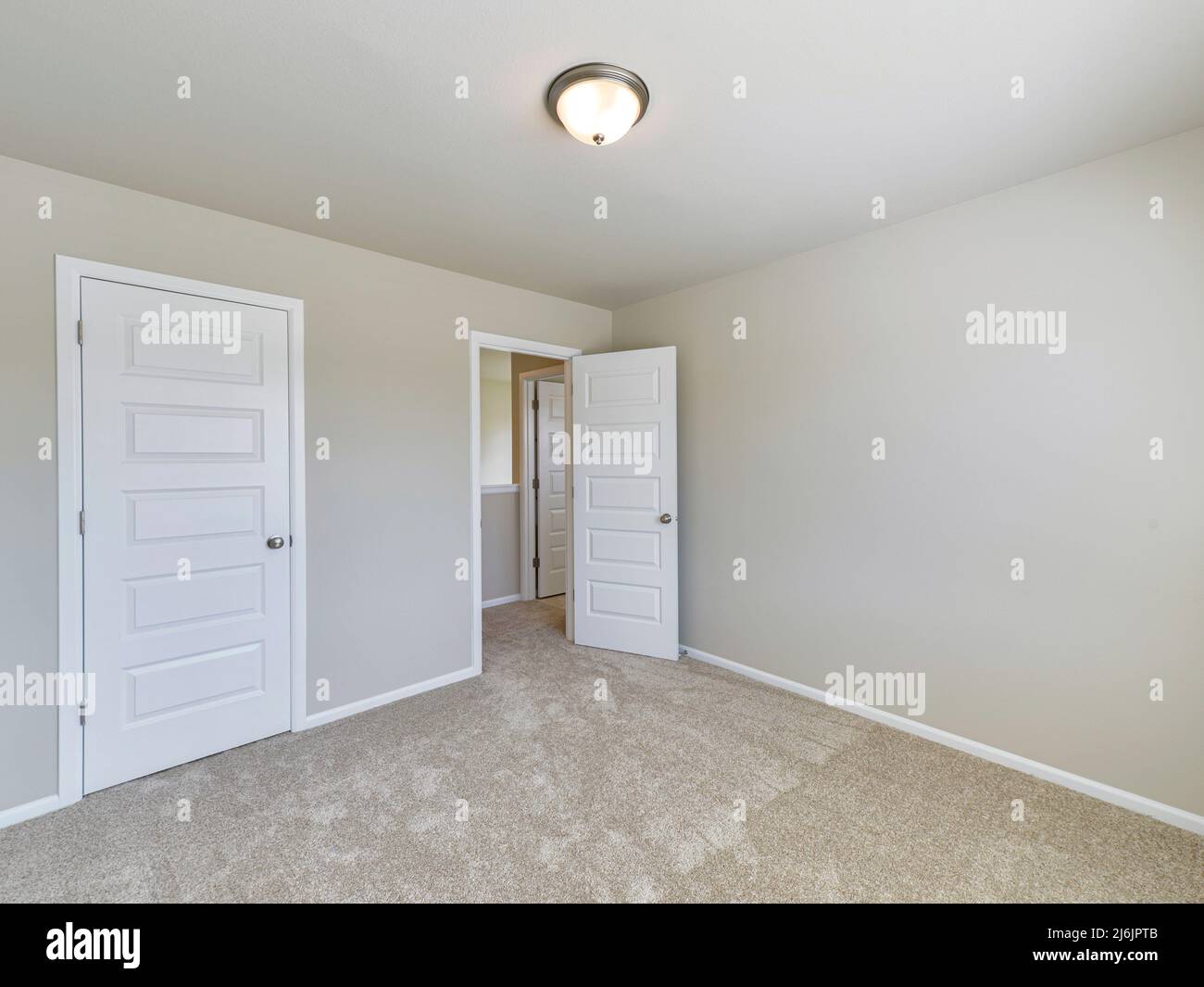 Modern residential empty bedroom interior Stock Photo - Alamy